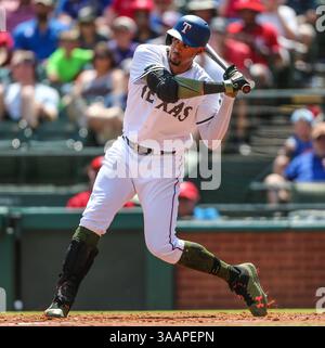 Texas Rangers' Ronald Guzman bats during the second inning of a spring ...