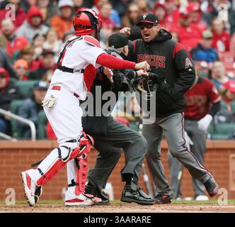 Arizona Diamondbacks manager Torey Lovullo, left, takes the ball from ...