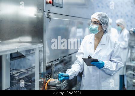 Industry inspector team working, QC staff work checking machine ...