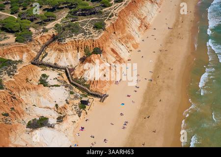 AERIAL VIEW. The incredibly colorful Praia da Falésia (Cliff Beach ...