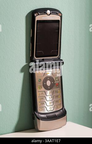 Classic Motorola Razr V3 opened, showcasing its slim design and keypad ...