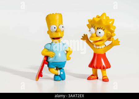 Bart Simpson leaning on skateboard and Lisa Simpson with arms raised ...
