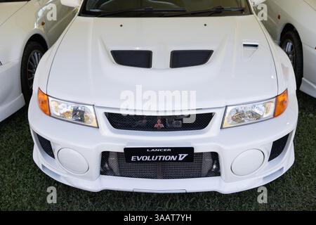 Close up of a white mitsubishi lancer evolution iii, highlighting its ...