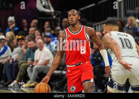 Los Angeles Clippers guard Kris Dunn (8) shoots as Denver Nuggets ...