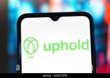 In this photo illustration, the Uphold logo seen displayed on a ...