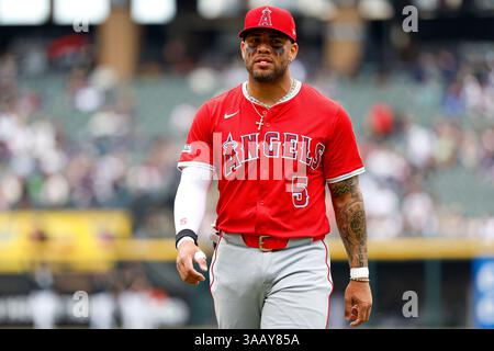 Los Angeles Angels' Yoan Moncada, left, is congratulated by first base ...
