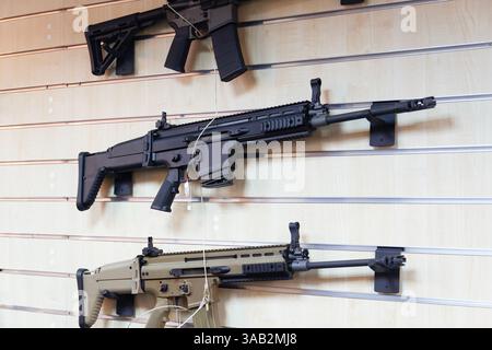 Modern automatic rifle on the window of the gun shop. Weapon Stock ...