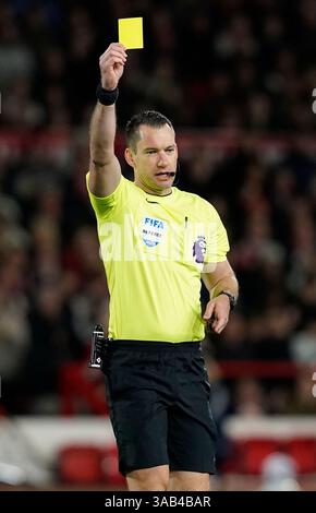 Referee Jarred Gillett shows a yellow card during the Sky Bet ...