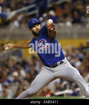 Former Chicago Cubs' Jake Arrieta throws a ceremonial first pitch ...