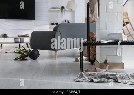 Chaotic living room interior after strong earthquake Stock Photo - Alamy