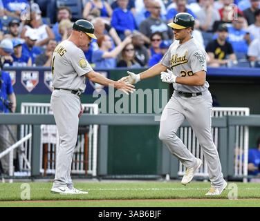 Oakland Athletics' Matt Olson, left, waits for the throw from catcher ...