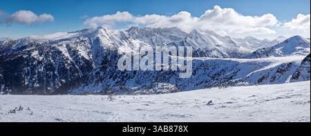 Pirin mountain peaks covered with snow in winter foggy day. Bansko ...