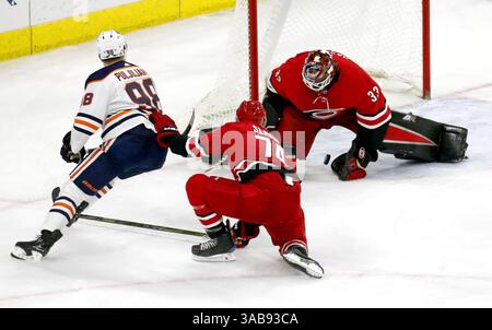 United States' Jaccob Slavin (74), Canada's Travis Sanheim (6) and ...