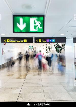 exit sign under the ceiling Stock Photo - Alamy