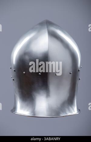 Silver Medieval Barbute Helmet with Brass Trim. This image shows a ...