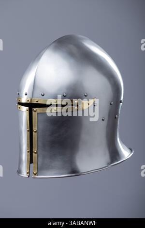 Silver Medieval Barbute Helmet with Brass Trim. This image shows a ...