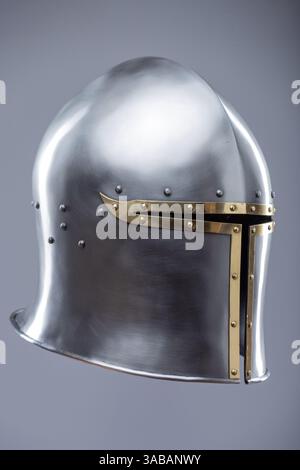 Silver Medieval Barbute Helmet with Brass Trim. This image shows a ...