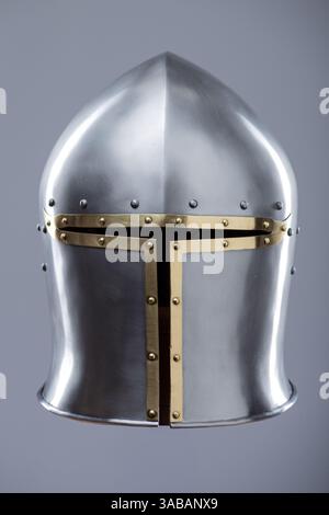 Silver Medieval Barbute Helmet with Brass Trim. This image shows a ...