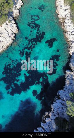 Aerial view of Port-Pin Cove, a hidden rocky inlet with turquoise water ...