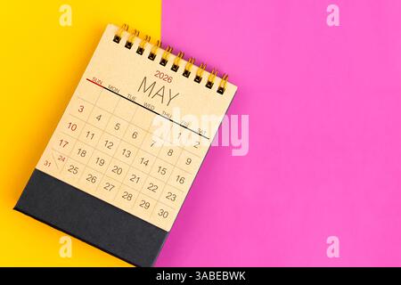 May 2026 calendar brown paper page on purple color background Stock ...