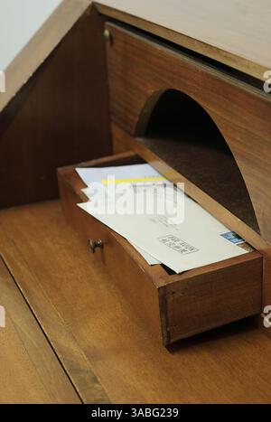 wooden desk with an open drawer in the office Stock Photo - Alamy