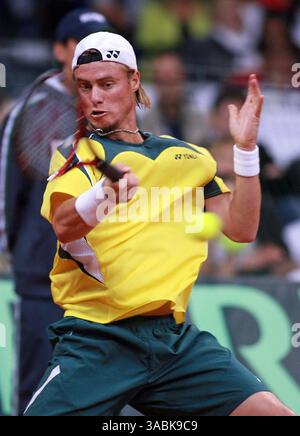Janko Tipsarevic of Serbia returns a ball to Filip Prpic of Sweden ...