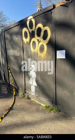 An artwork by mystery street artist Banksy appeared above a fish and ...