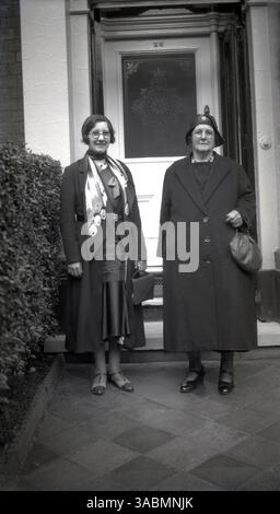 circa 1930s, historical, two ladies in clothes of the era and wearnig ...