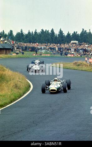 Jack Brabham (AUS) Brabham BT19 leads second placed John Surtees (GBR ...