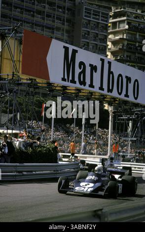 Jody Scheckter (RSA) Tyrrell 007 celebrates victory on the JPS mobile ...