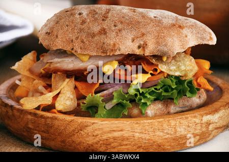 Pan chapla with chicharrón, a traditional breakfast from Ayacucho, Peru ...