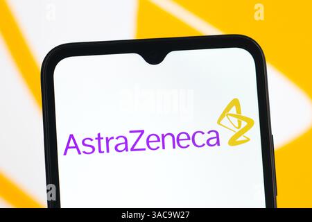 In this photo illustration, the logo of AstraZeneca is seen displayed ...