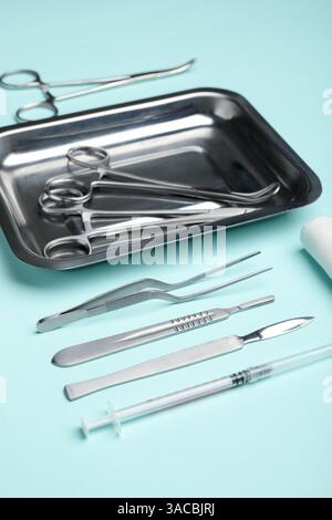Different surgical tools on turquoise background, flat lay Stock Photo ...