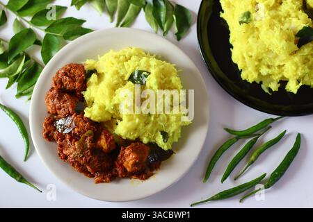 Boiled and mashed tapioca served with rich and spicy chicken curry ...