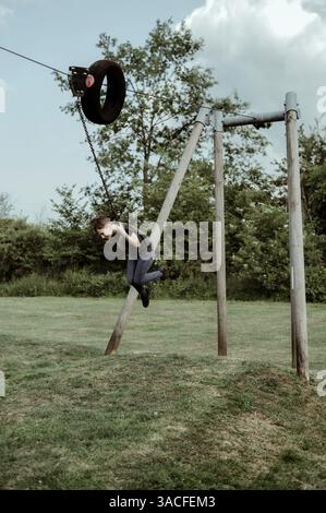 Child is playing at cableway at playground Stock Photo - Alamy