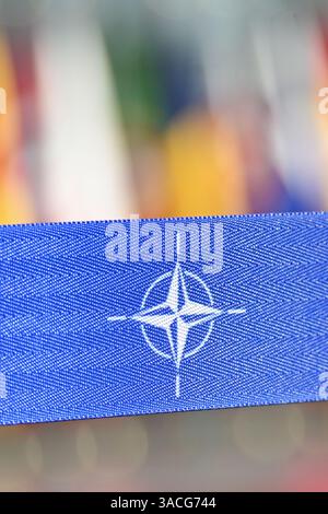 SYMBOL - 04 April 2025, Belgium, Brüssel: A NATO flag flies in the wind ...