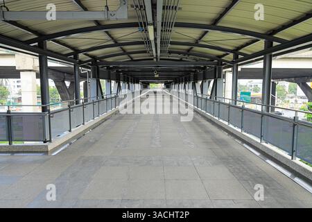 Pedestrian pathway or corridor or hallway between train station and ...