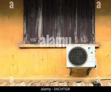Modern wall-mounted air conditioner installed in a room, providing ...