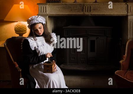 Scenes of a beautiful young Victorian maid doing house chores in an ...