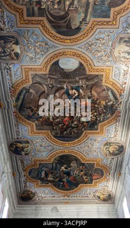 Baroque ceiling frescoes illustrating biblical scenes within a ...