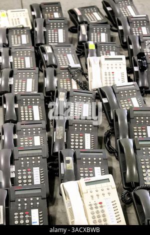 Old desk phones being disgarded Stock Photo - Alamy