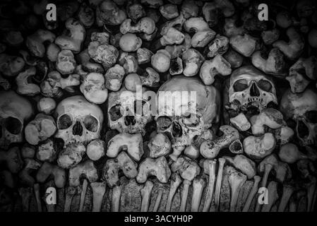 Stacked human bones and skulls built to a wall in an old Southern ...