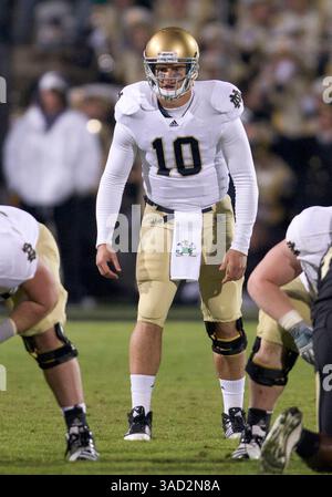Notre Dame quarterback Dayne Crist drops back to throw in front of ...