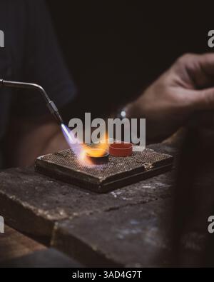 Goldsmith making gold wedding rings Stock Photo - Alamy