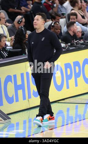 San Antonio Spurs acting head coach Mitch Johnson, right, speaks with ...