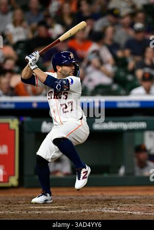 Houston Astros left fielder Jose Altuve catches a fly ball in foul ...
