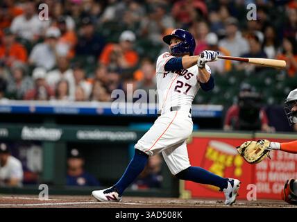 Houston Astros left fielder Jose Altuve catches a fly ball in foul ...