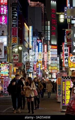 Kabukicho building facades glow in the night with neon signs, the ...