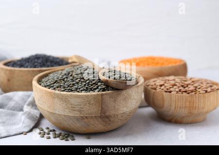Different types of lentils on light table, closeup Stock Photo - Alamy