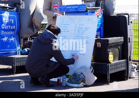 A board listing the runners of the Grand National on day three of the ...
